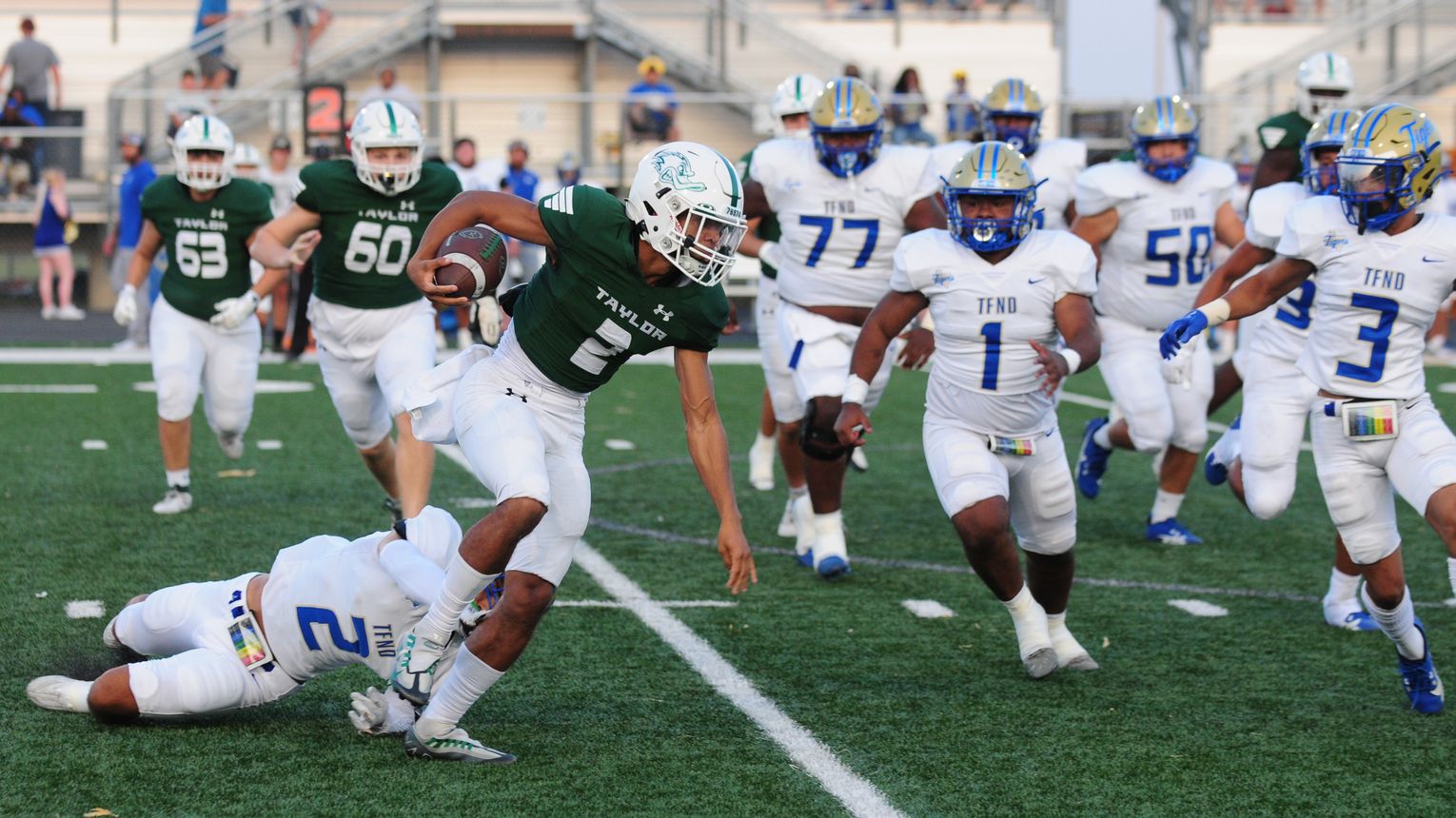 Taylor football overwhelms rival Rockdale